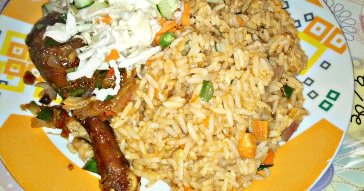 Jollof Rice Garnished With Cucumber And Cabbage Recipe by Judith Okpe ...