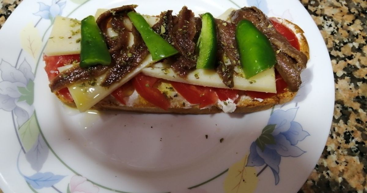 Light Dinner: Toasted Bread Slice With Manchego Cheese And Anchovies ...