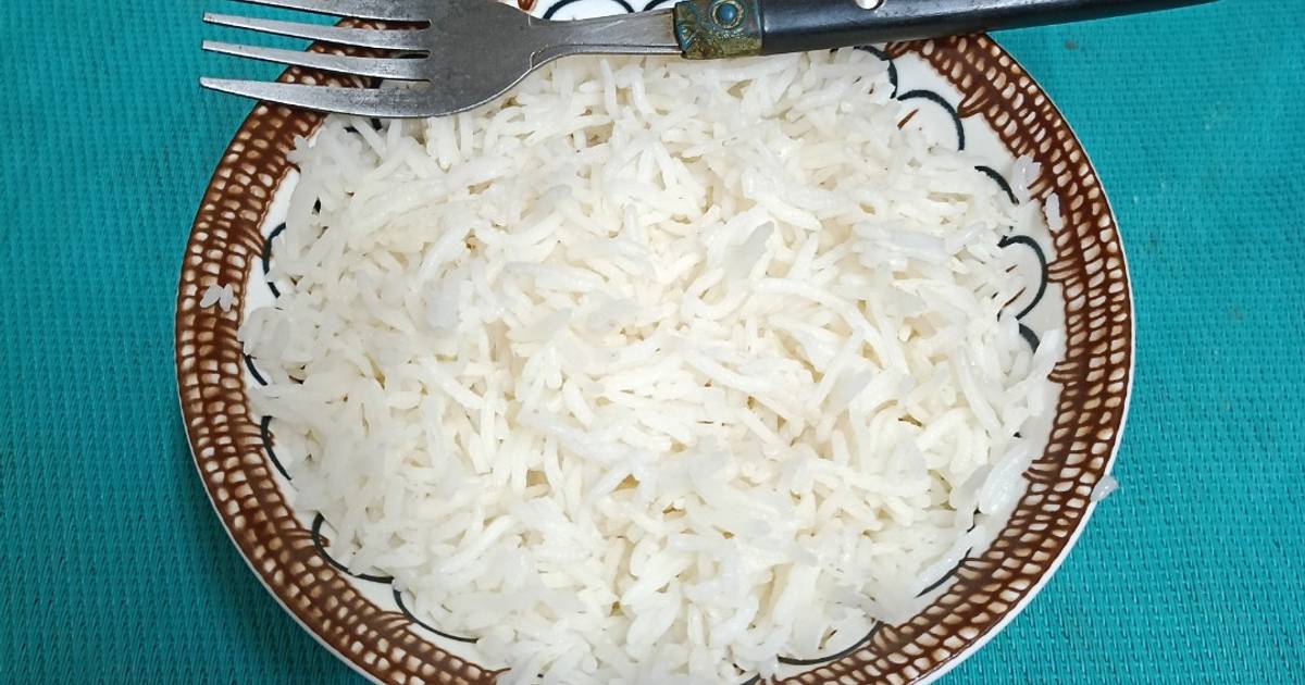 A bowl Of Steaming Hot Basmati Rice In A Pressure Cooker Recipe by Bina ...