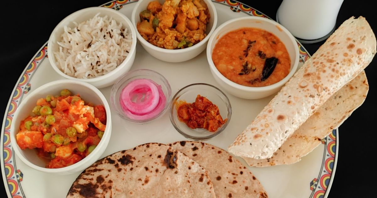 North Indian Thali For Lunch Mutter Paneer, Aloo Gobhi, Moong Dal Tadka ...