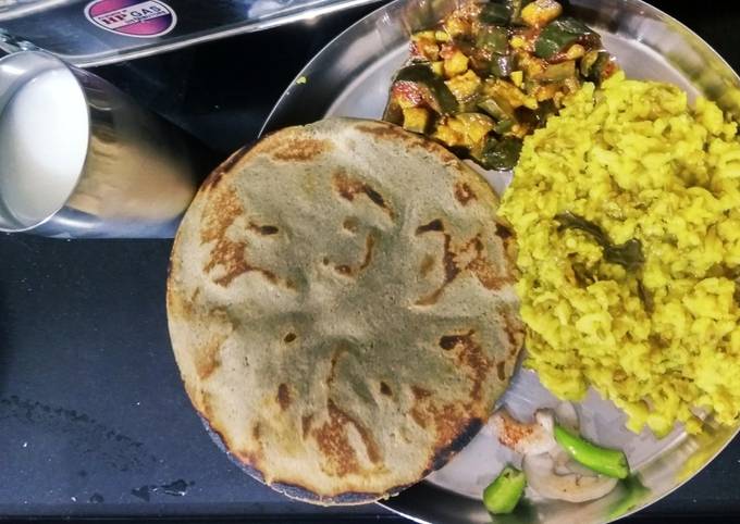Bajra no rotlo,lasaniya ringada nu shaak,khichadi upar ghee,chaas,onion ...